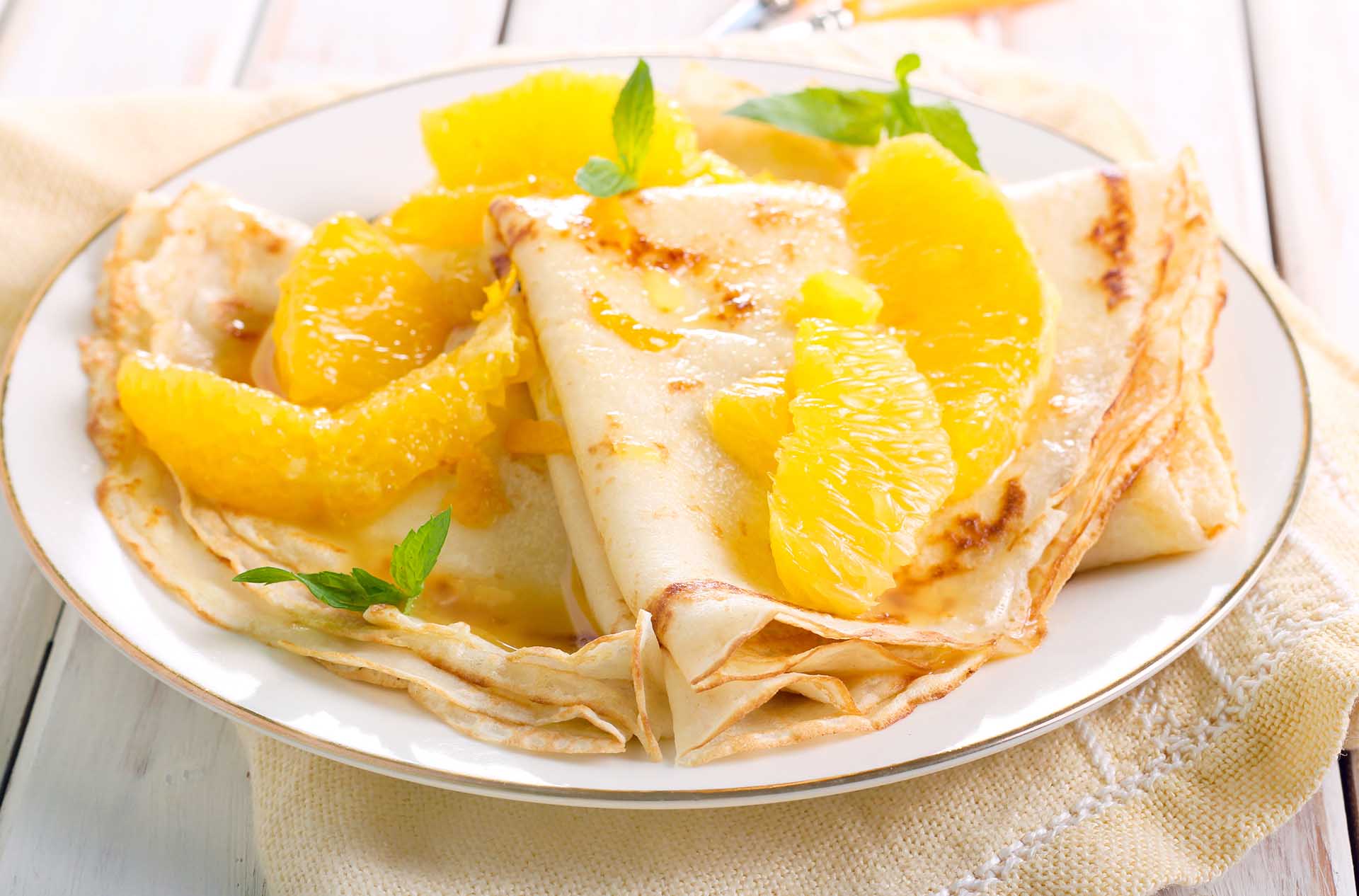 Dairy-free coconut crepes with orange sauce Recipe | Buy West Eat Best